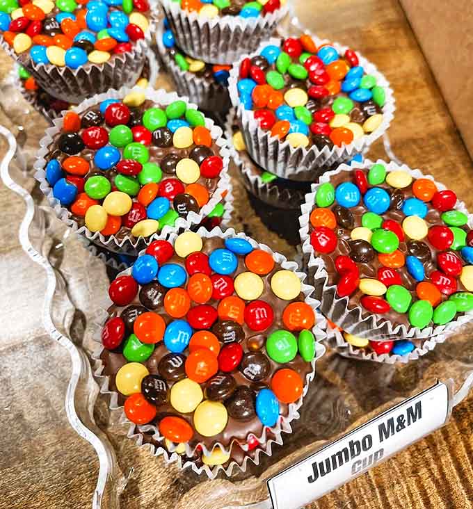 M&M cups that make you question why you ever settled for fun-size anything &ndash; these colorful giants are what childhood dreams are made of.