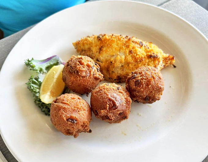Golden hush puppies surround perfectly cooked grouper &ndash; a Southern-meets-seafood combination that might just make you weep with joy.