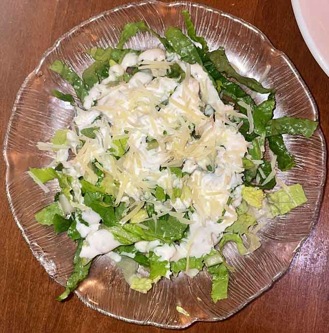 A Caesar salad that comes with every entree, because Luna Di Luna believes in starting things off right before the pasta party begins.