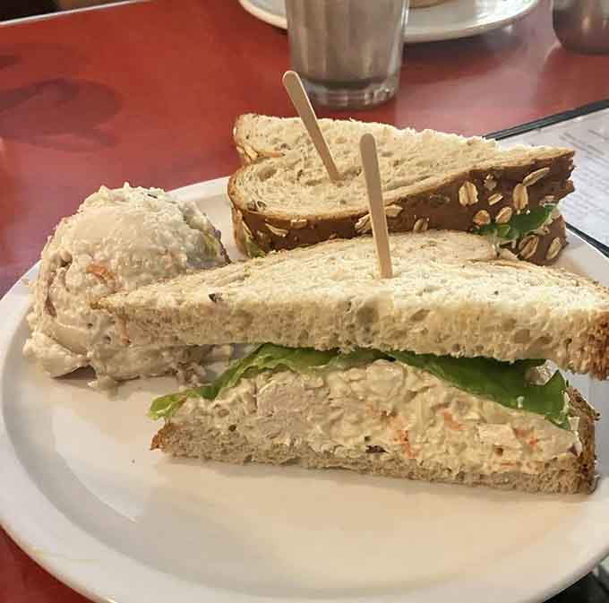 The turkey salad sandwich arrives on fresh bread with generous portions, proving that classic lunch fare can still surprise and delight your taste buds.