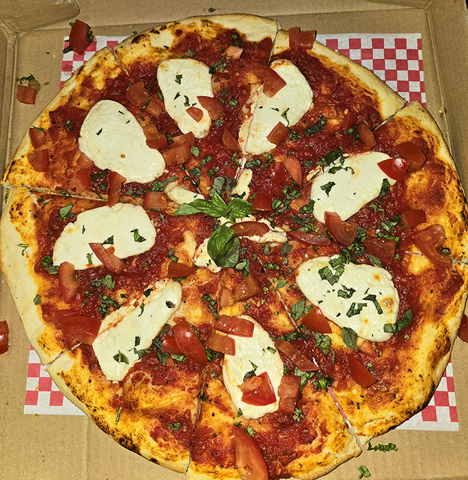 Simple perfection with vibrant tomatoes, fresh basil, and pools of melted mozzarella &ndash; sometimes the classics just can't be improved upon.