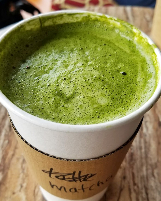 The vibrant matcha latte offers a moment of zen before the excitement of meeting your potential furry soulmate.