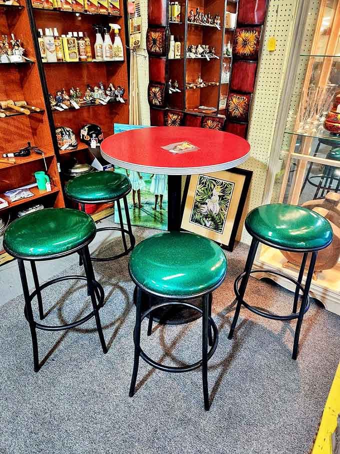 A perfect red formica table surrounded by mint-green vinyl stools &ndash; just waiting for imaginary milkshakes and burgers to complete the 1950s fantasy.