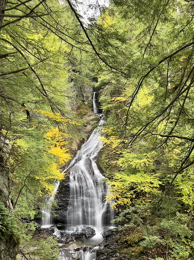 Moss Glen Falls cascades dramatically through a verdant gorge, offering a reward that far outweighs the short hike required to witness it.
