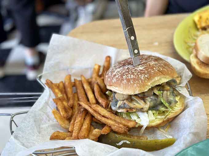 This mushroom burger understands that fungi deserve their moment in the spotlight, piled high and ready to make a delicious mess.