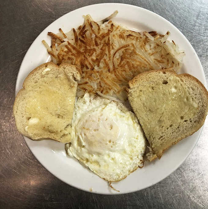 Breakfast perfection: crispy hashbrowns, eggs with personality, and toast that makes standard bread hang its head in shame.