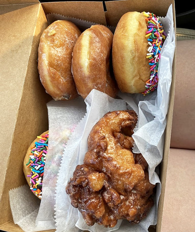 This box of mixed donuts and fritters represents more joy than most people experience in a week, all for under twenty bucks.