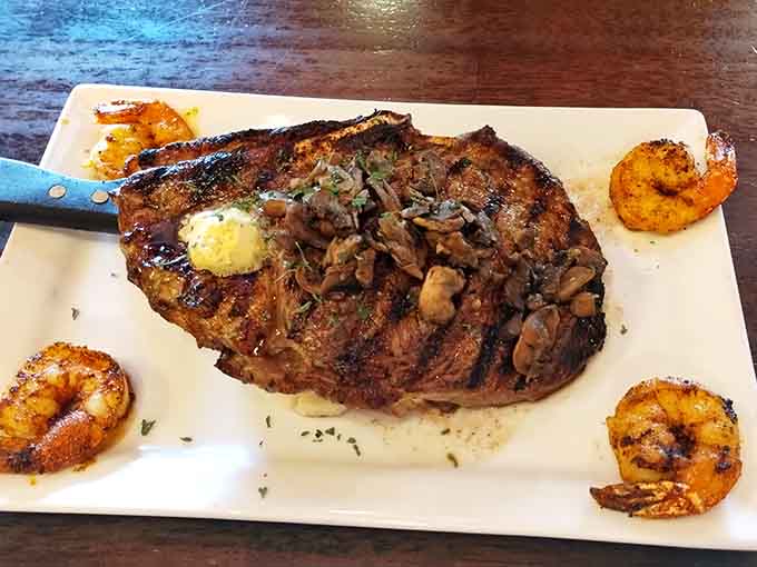 That ribeye topped with mushrooms and shrimp delivers surf and turf without the pretension, just pure deliciousness on a plate.