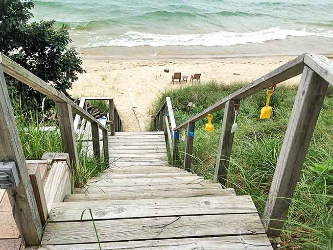 Stairs descending to the beach feel like a portal between the everyday world and vacation mode, no time machine required.