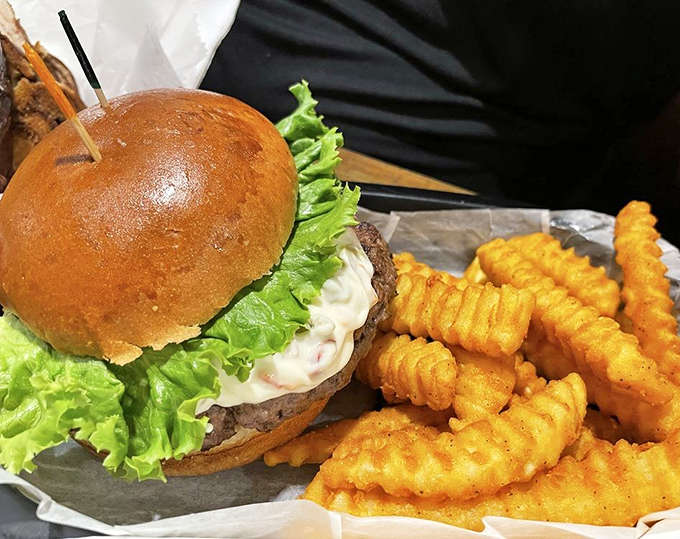Behold the legendary Olive Burger in all its glory &ndash; that signature olive sauce creates a tangy, creamy masterpiece that's pure Michigan culinary heritage.