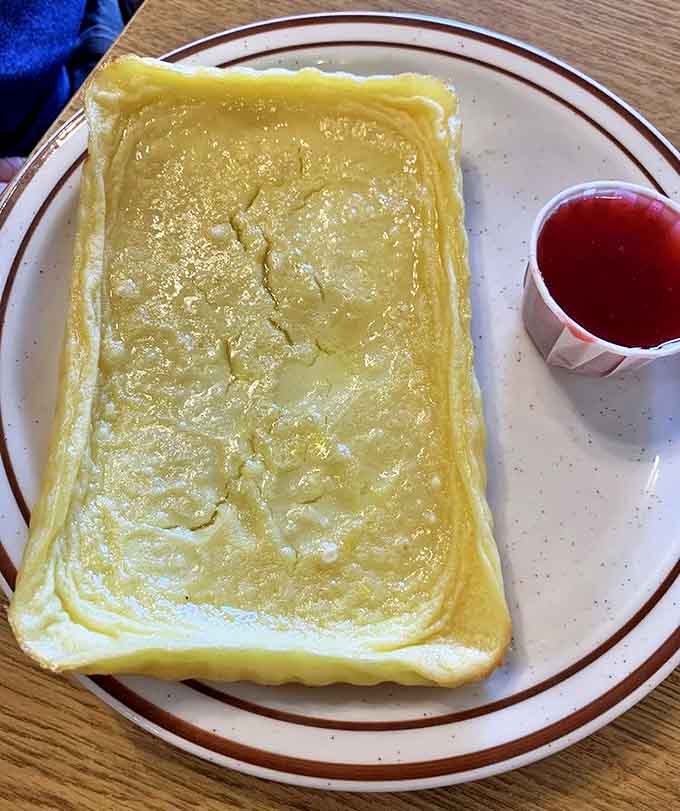 Golden, crispy edges give way to a custardy interior – this isn't just breakfast, it's a cultural experience on a plate.