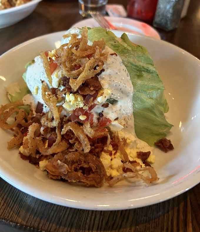 The wedge salad proves that iceberg lettuce deserves respect when it's loaded with bacon, blue cheese, and creamy dressing.