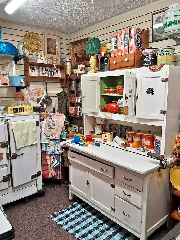 Grandma's kitchen comes alive in this corner, where vintage Hoosier cabinets and colorful enamelware transport you to Sunday dinners circa 1952.