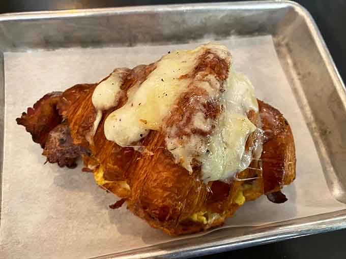 That ham and cheese croissant oozing with melted goodness is basically a warm hug in pastry form for your taste buds.