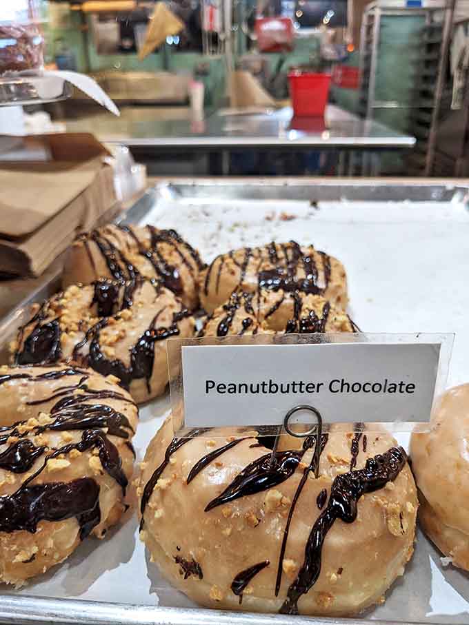 Peanut butter and chocolate: a combination so perfect it makes you wonder if they were separated at birth and reunited on this glorious donut.