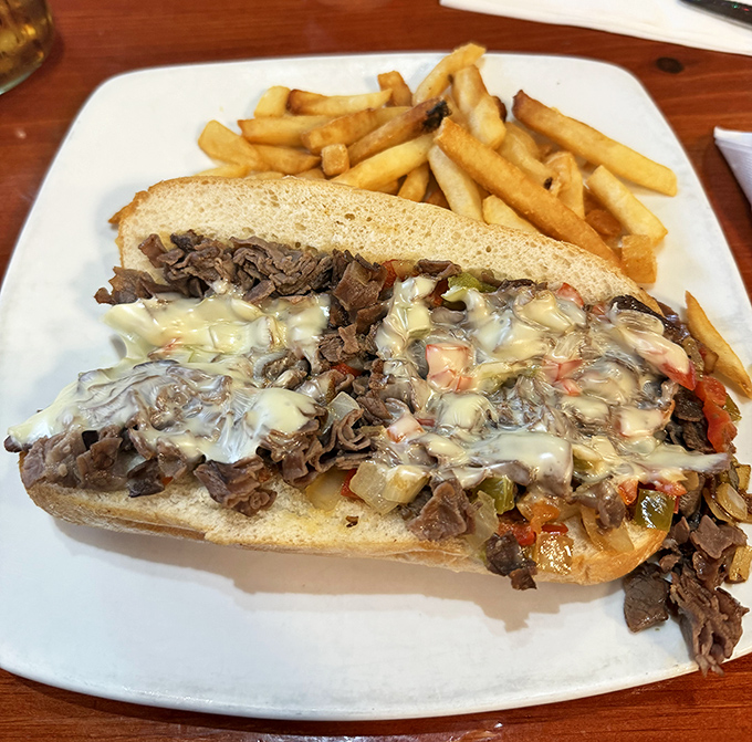 The Philly cheesesteak demands multiple napkins and zero shame as you devour every last morsel of this messy masterpiece.