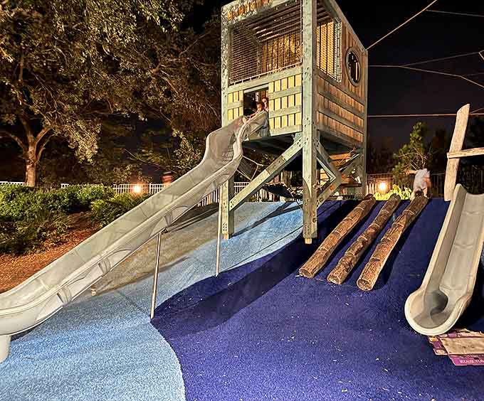 As dusk falls, the playground transforms into a magical nighttime seascape that makes "five more minutes" the evening's most repeated phrase.