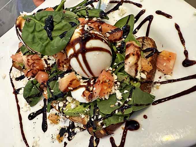This isn't just avocado toast &ndash; it's a masterpiece of textures and flavors topped with a perfectly poached egg and balsamic drizzle.