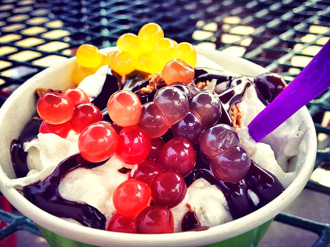 Those little green popping boba spheres – tiny flavor grenades that transform ordinary yogurt into an interactive taste adventure.