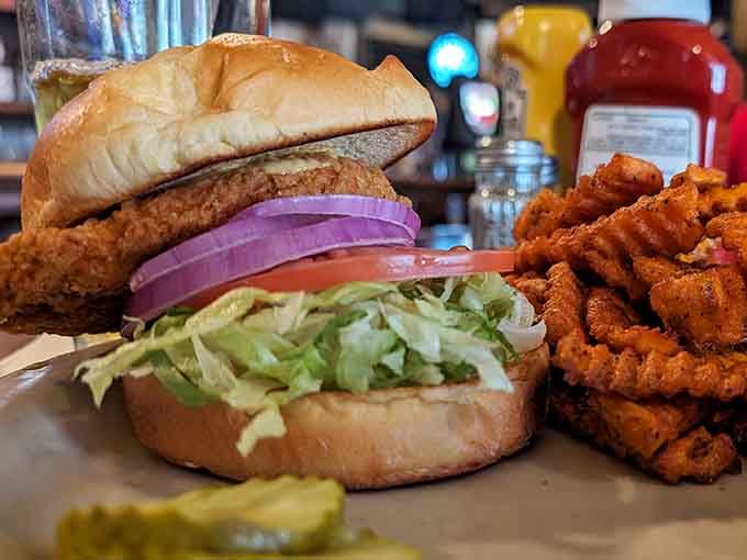 A crispy chicken sandwich with curly fries delivers exactly what you're craving when walleye isn't calling your name that particular day.