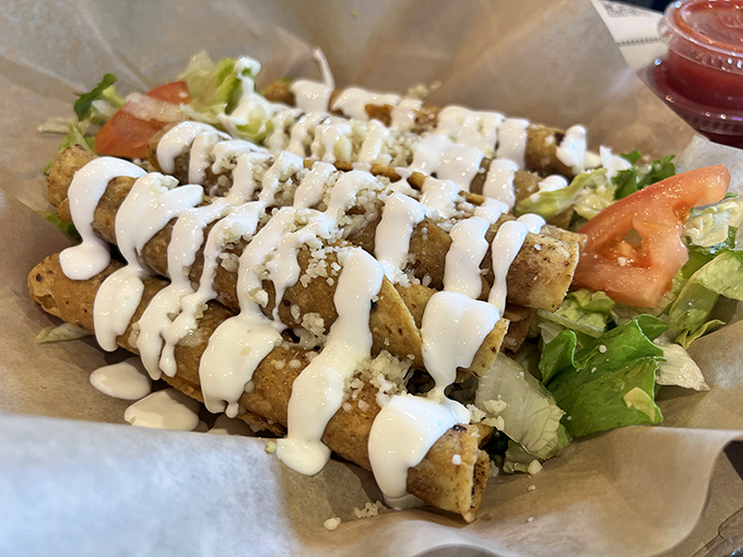 These rolled tacos with their zigzag of sour cream are like the synchronized swimmers of Mexican cuisine – perfectly aligned and ready to dive into your mouth.