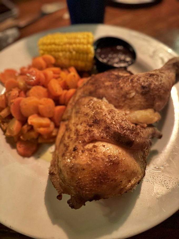 Golden-brown rotisserie chicken that's been spinning its way to perfection, flanked by cowboy beans that deserve their own rodeo championship.