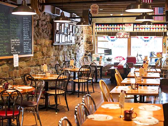 Exposed stone walls and wooden Windsor chairs create an atmosphere where time slows down just enough to savor every spoonful.