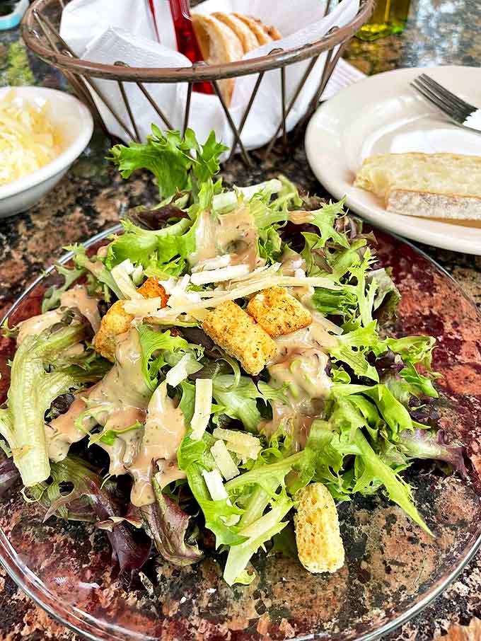 Even the salads demand respect here – fresh greens playing host to a carefully choreographed dance of textures and house-made dressings.