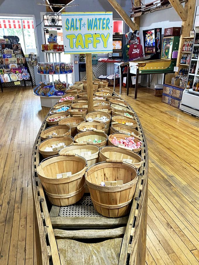 The salt water taffy display transforms an authentic wooden canoe into a vessel of sugary delight &ndash; nautical nostalgia at its sweetest.