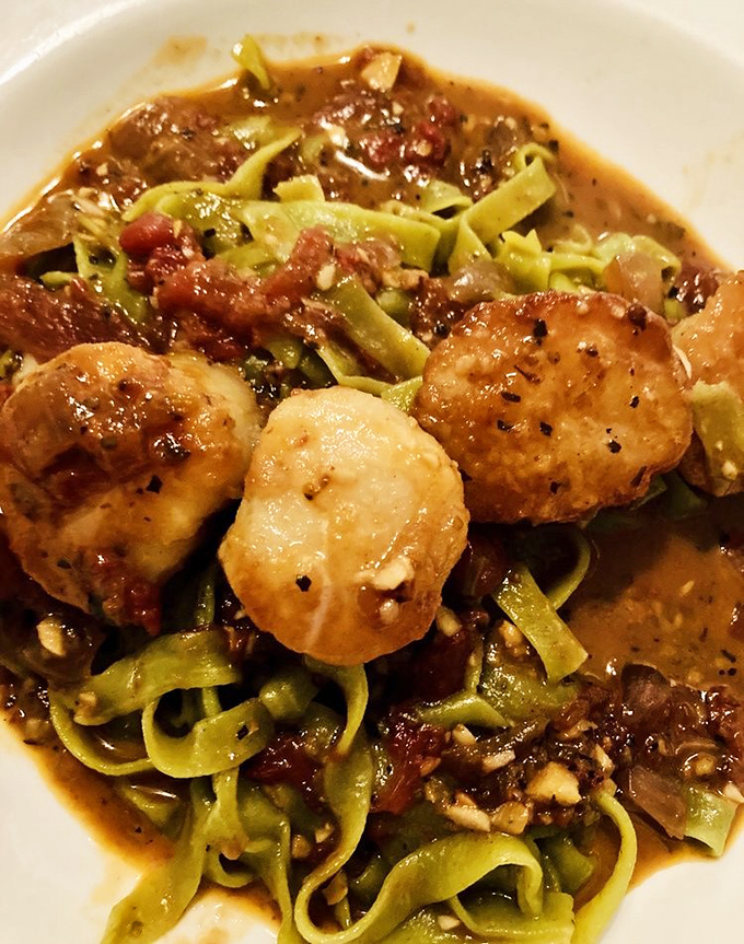 Sweet meets heat in this bold interpretation &ndash; delicate scallops hold their own against a robust tomato sauce that demands bread for sopping.