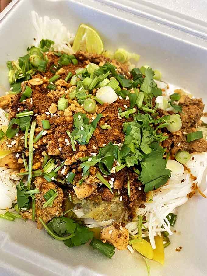 Shan noodles crowned with aromatic herbs and spices&mdash;proof that in Myanmar, noodles aren't just food, they're an art form.