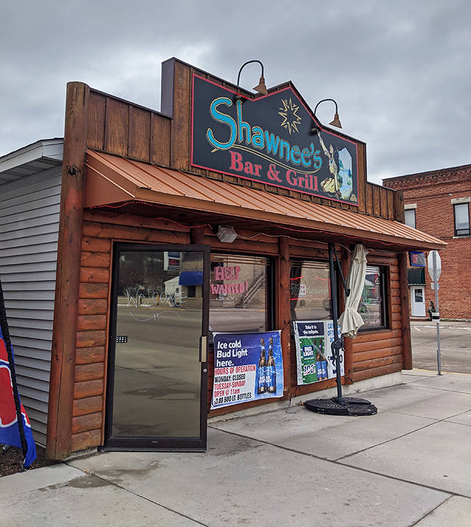 Shawnee's Bar & Grill welcomes hungry travelers with its rustic wooden exterior promising authentic local flavors without any pretense.