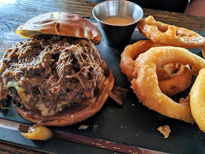 Those onion rings aren't just decoration, they're crispy golden circles of pure joy that deserve their own fan club.