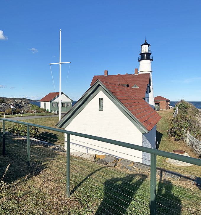 From this angle, you can appreciate how the lighthouse stands sentinel over the Atlantic, its silhouette recognizable to generations of sailors seeking safe harbor.