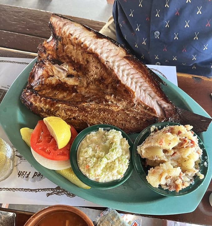 Florida's humble mullet transformed into smoky gold, accompanied by German potato salad and coleslaw that complement rather than compete with the star.