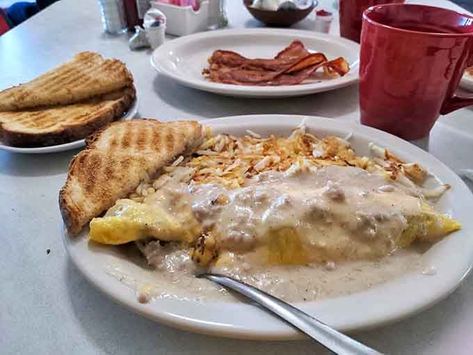 That omelet's loaded with enough fillings to make you forget you ever considered ordering plain scrambled eggs like some kind of breakfast amateur.