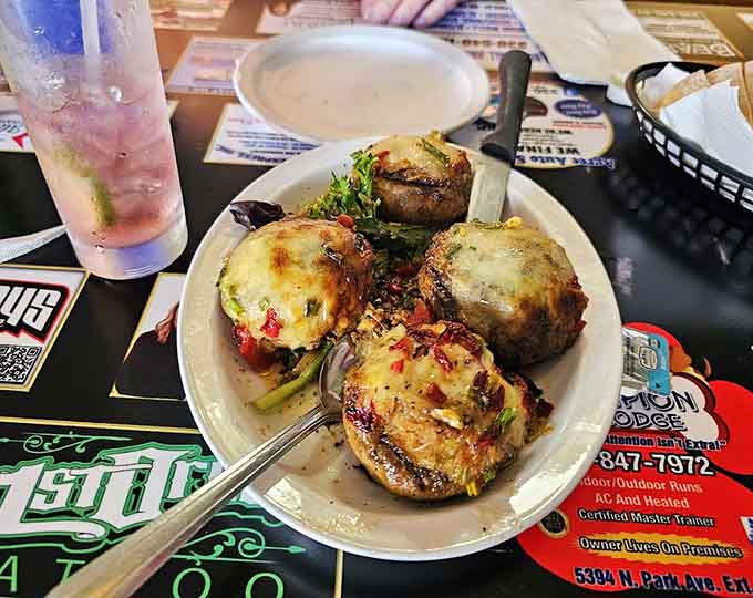 Four plump mushrooms stuffed with savory goodness, because sometimes you need to start strong before the main event arrives.