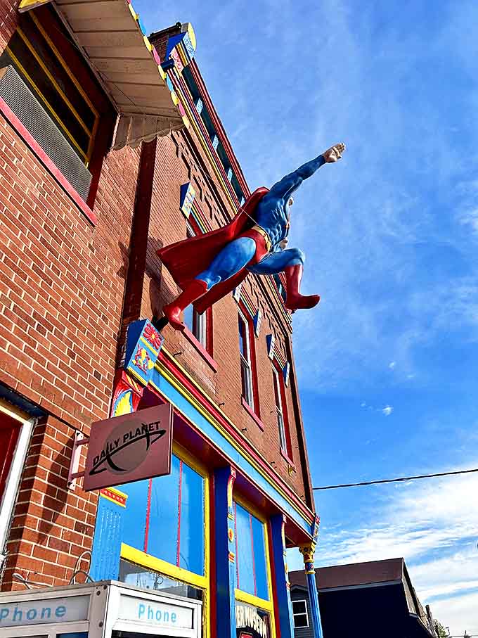 The Superman statue stands ready to save the day or at least pose for countless tourist photos, wearing his classic costume with the confidence of someone who knows he looks good in primary colors.