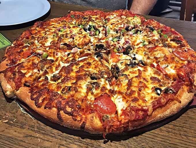 This fully-loaded masterpiece proves that more is definitely more when it comes to pizza toppings done right and done well.