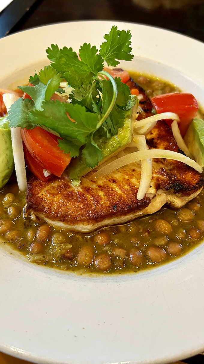 The swordfish special showcases the kitchen's talent for letting quality ingredients shine, with bright herbs and vegetables complementing the perfectly cooked fish.