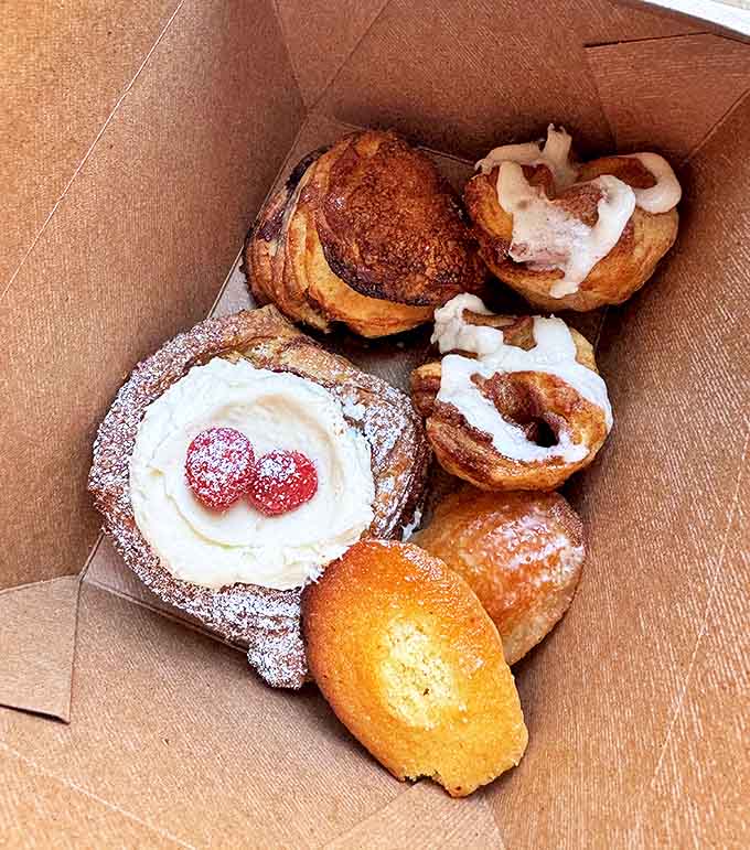 A treasure chest of French pastries that makes pirate gold look boring. That cream-filled beauty with raspberries is calling your name.