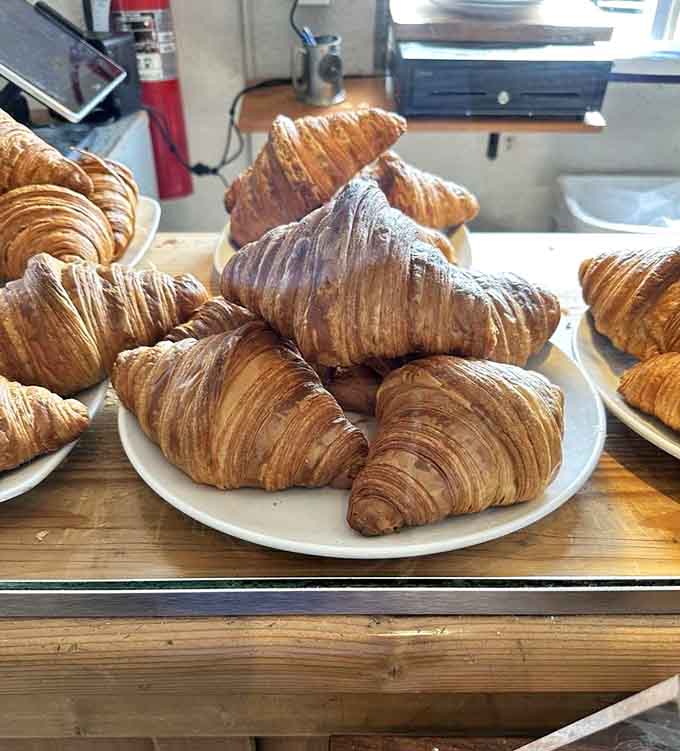 A pile of golden, buttery croissants that would make any French baker nod with approval.