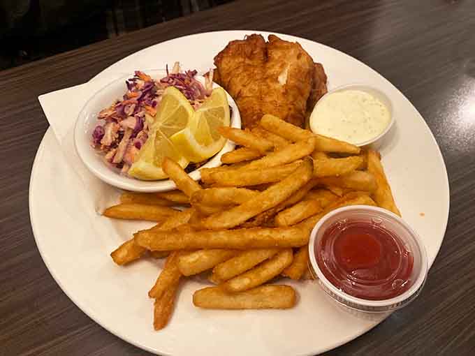 Golden, crispy walleye and chips deliver that satisfying crunch alongside creamy coleslaw, proving that classic combinations never go out of style.