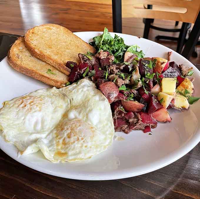This plate proves breakfast doesn't have to choose between hearty and delicious, with perfectly cooked eggs, crispy toast, and a colorful hash that's almost too pretty to eat.