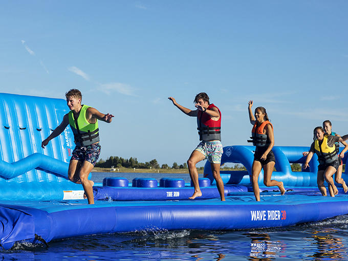 Balance, determination, and the unspoken agreement that someone's definitely ending up in the water. Spoiler alert: it's everyone.