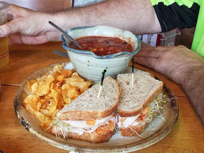 This sandwich comes with soup and chips, creating the holy trinity of lunchtime satisfaction that'll fuel your afternoon perfectly.