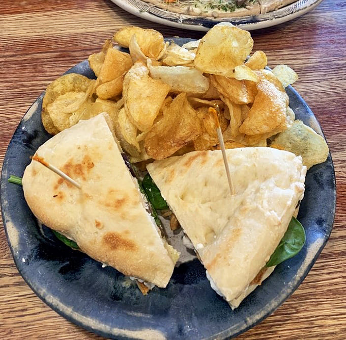 Kettle chips and fresh veggies accompany a sandwich that proves simple ingredients, done right, beat fancy complications every single time.