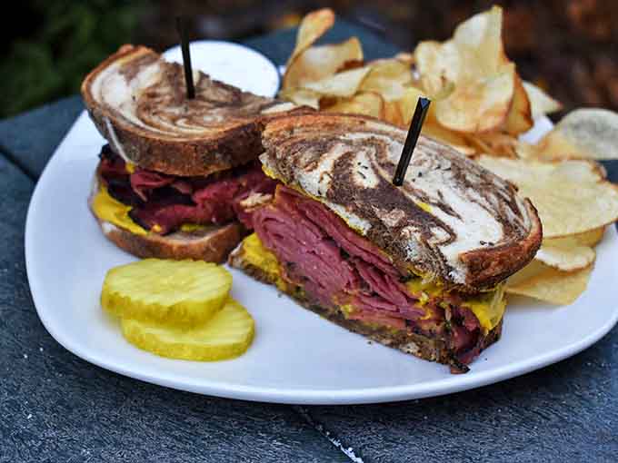 The Reuben that ruins all other Reubens &ndash; a mountain of tender corned beef on marble rye with perfectly melted Swiss and just the right amount of sauerkraut.