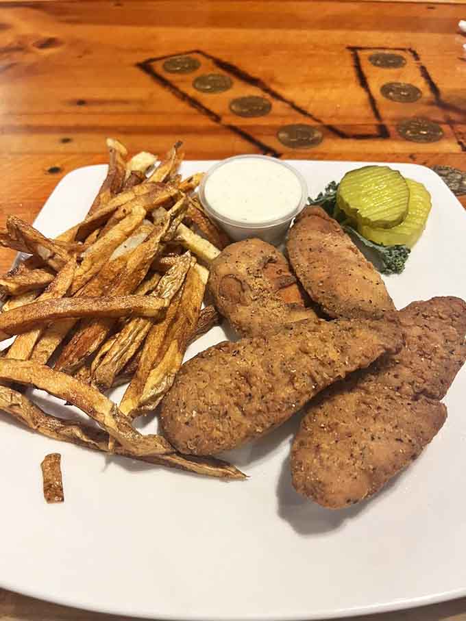 Golden chicken fingers arrive crispy and hot, perfect comfort food for travelers of all ages.