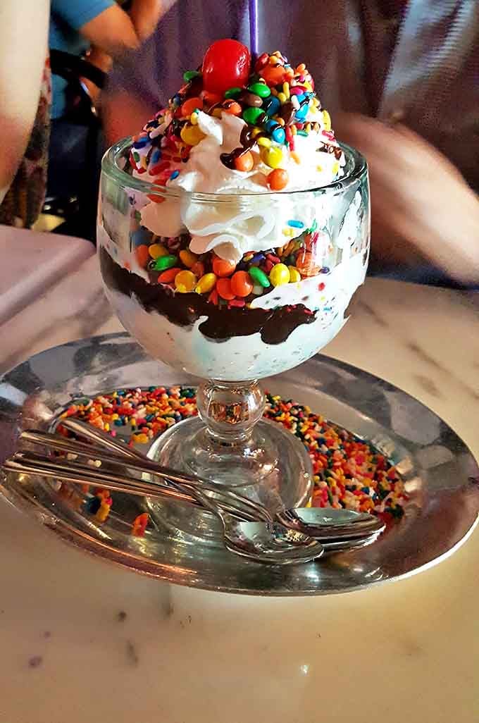 Chocolate, caramel, and sprinkles unite in a dessert that moves so slowly to your table because it's weighed down by deliciousness.